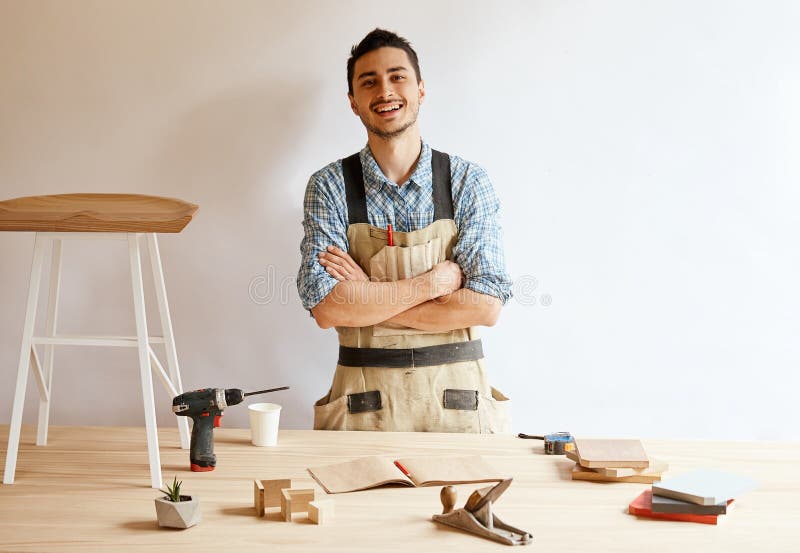 Confident Young Woodworker Standing Next To Workbench in His Carpentry ...