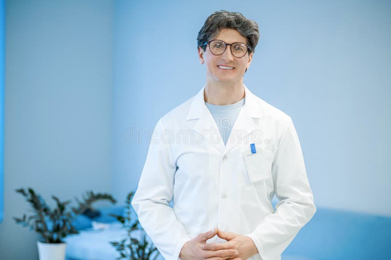 Confindent Male Doctor Smiling and Looking Good Stock Photo - Image of ...
