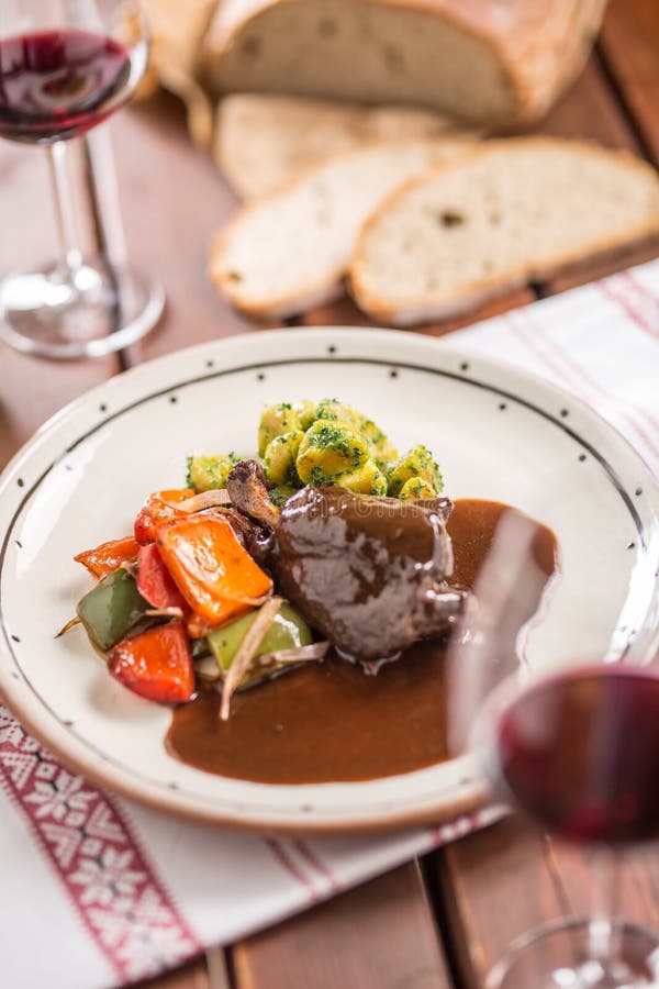 Confit Rabbit Leg with Vegetable Bread Redvine in Pub or Restaur Stock ...