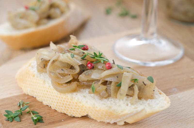 Confit of Shallots on a Piece of Baguette Stock Photo - Image of canape ...