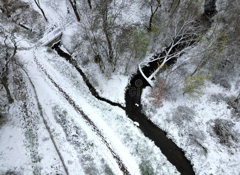 The Confluence of a Small Stream and a Larger River Across Which a ...