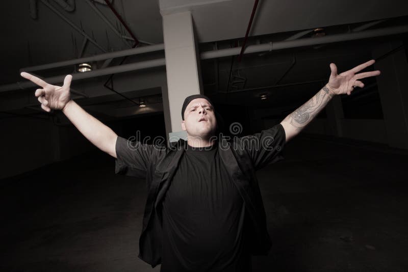 Confrontational Man in a Dark Garage Stock Image - Image of male, adult ...