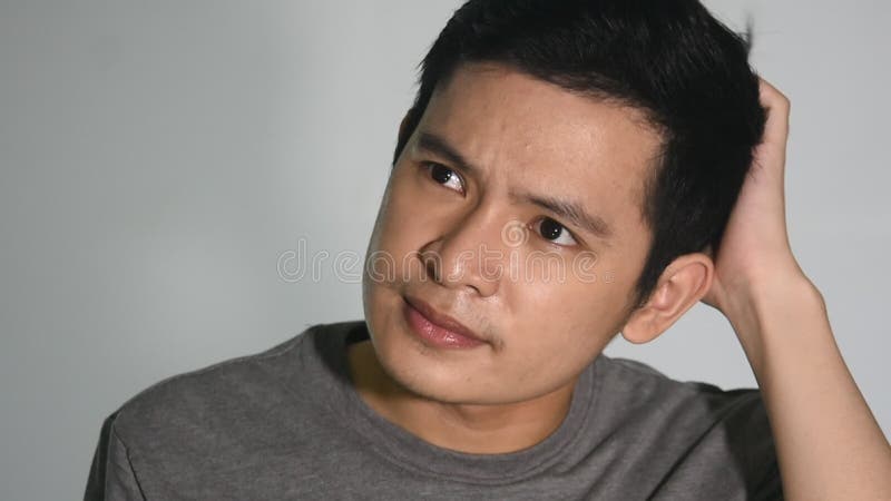 A Confused Asian Man Closeup Isolated Stock Footage - Video of confused ...