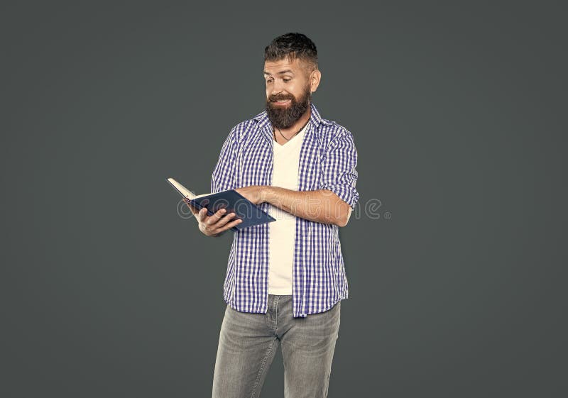 Confused Bearded Man Reading Book on Grey Background Stock Photo ...