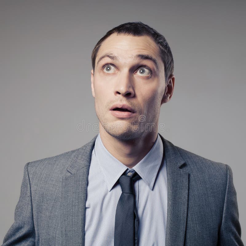 Confused Businessman on Gray Background Stock Image - Image of confused ...