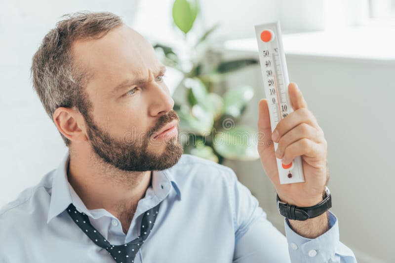 Confused Businessman in Hot Office Looking Stock Image - Image of ...