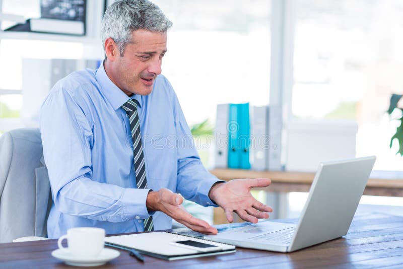 Confused Businessman Looking at Laptop Computer Stock Photo - Image of ...