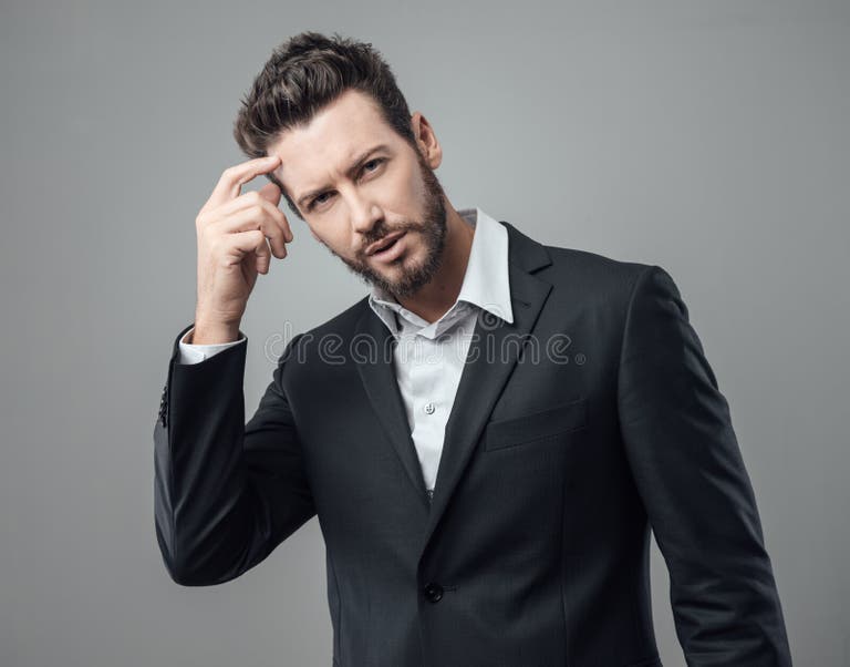 Confused Businessman Touching Temples Stock Image - Image of ...