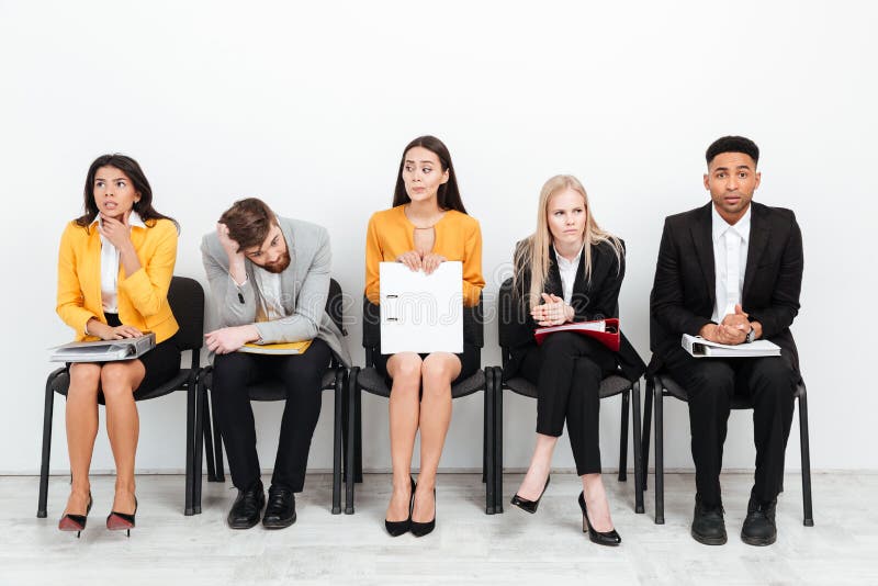 Confused Colleagues Sitting in Office. Stock Photo - Image of associate ...