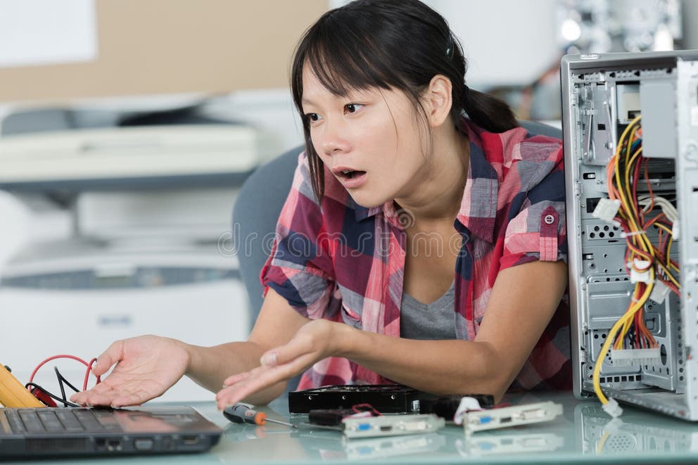 Confused Computer Female Technician Looking at Motherboard Stock Photo ...