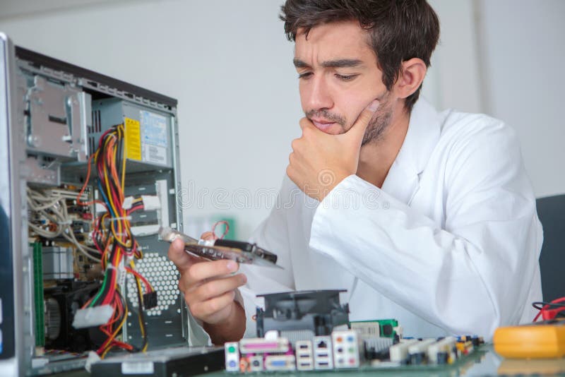 Confused Computer Technician Studying Component Stock Image - Image of ...