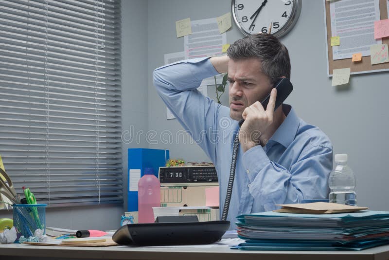 Confused Employee on the Phone Stock Photo - Image of occupation ...