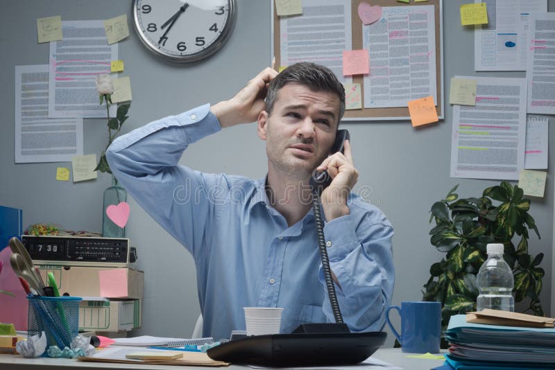 Confused Employee on the Phone Stock Photo - Image of answering ...
