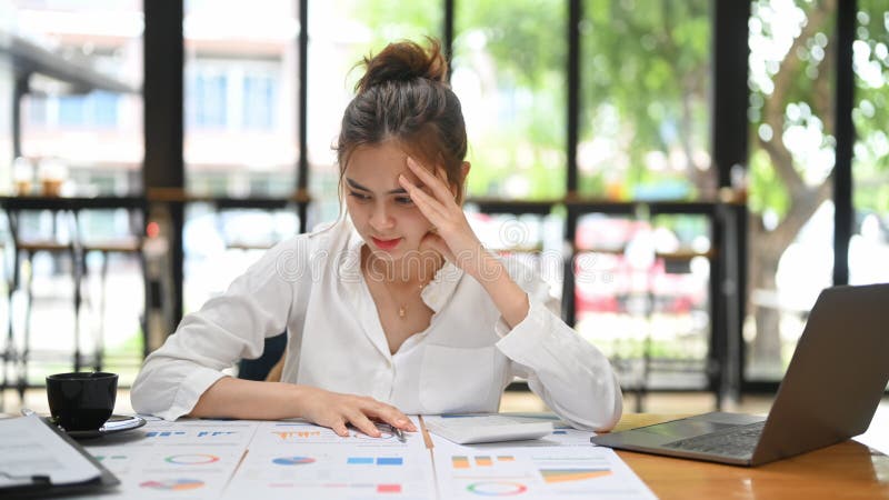 Confused Female Employee Sitting at Her Workplace Thinking of Problem ...