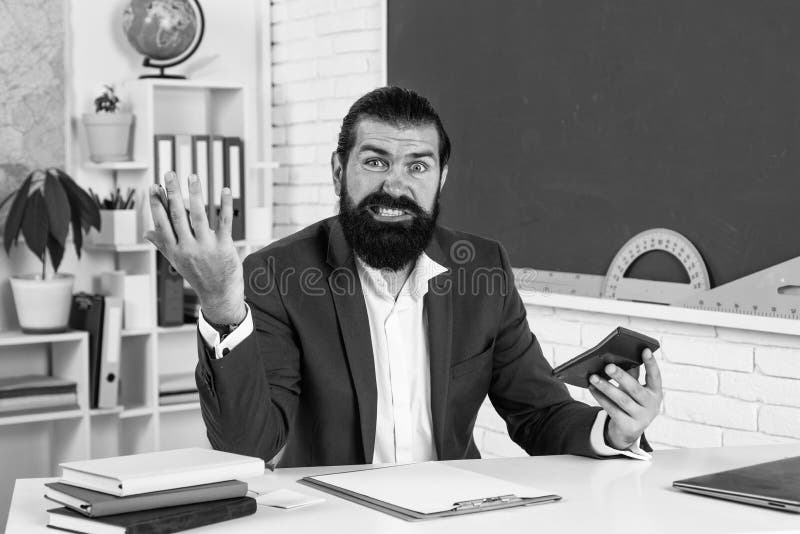 Confused Guy with Beard Calculating on Calculator in School Math Lesson ...