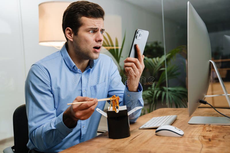 Confused Handsome Young Business Man Using Mobile Phone Stock Image ...