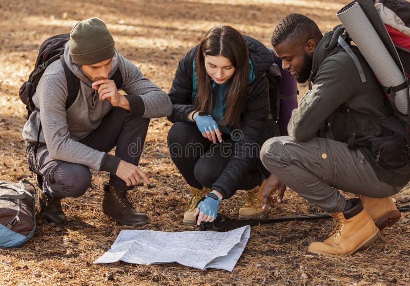 Confused Hikers Looking at Map, Lost in Forest Stock Photo - Image of ...
