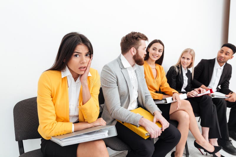 Confused Lady Sitting Near Colleagues in Office Stock Photo - Image of ...
