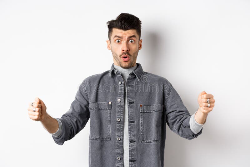 Confused Man Holding Big Size Object and Looking Shocked, Shaping Large ...