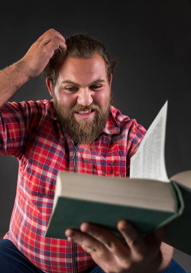 Confused Man Reading a Book Stock Image - Image of doubt, confusion ...