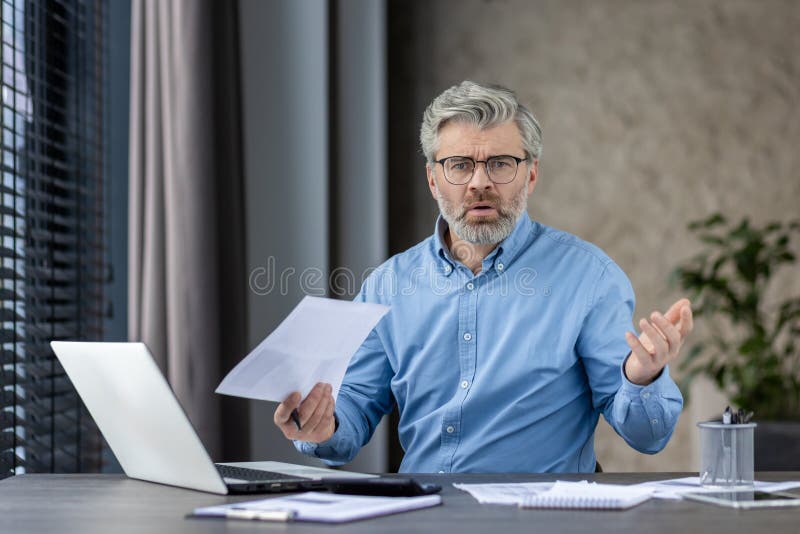 Confused Office Worker Reading Documents Stock Photos - Free & Royalty ...