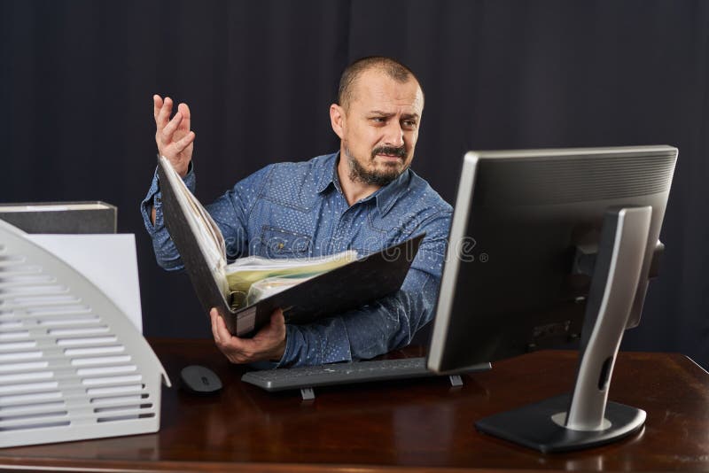 Confused office worker stock photo. Image of busy, mature - 207325022