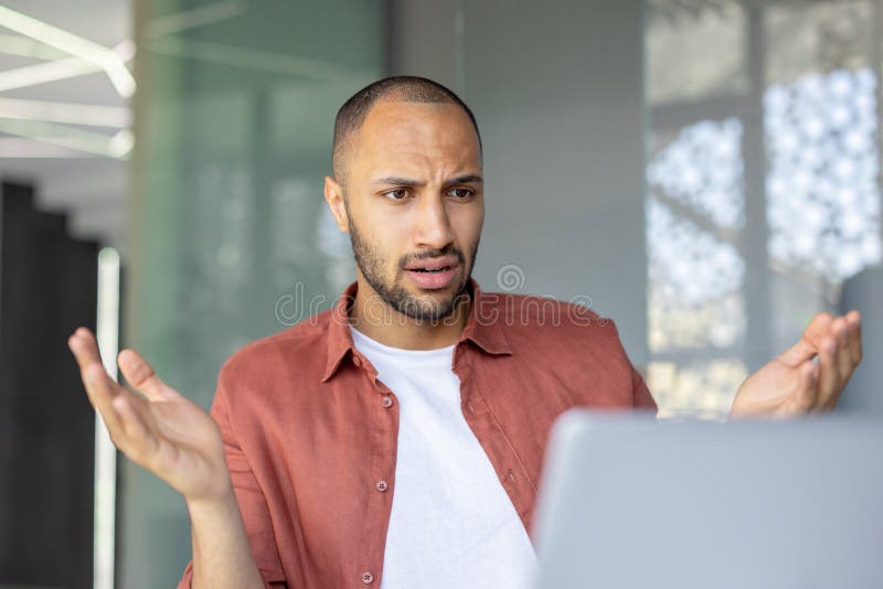 Confused Office Worker Gesturing at Computer during Virtual Meeting ...
