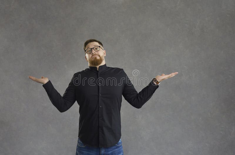 Confused Puzzled Man with Doubt Face Spreading Hands Widely Studio Shot ... Confused Puzzled Man with Doubt Face Spreading Hands Widely Studio Shot ...