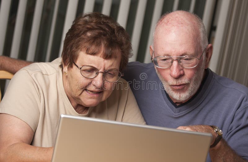 Confused Senior Adult Couple Having Fun on the Computer Stock Photo ...