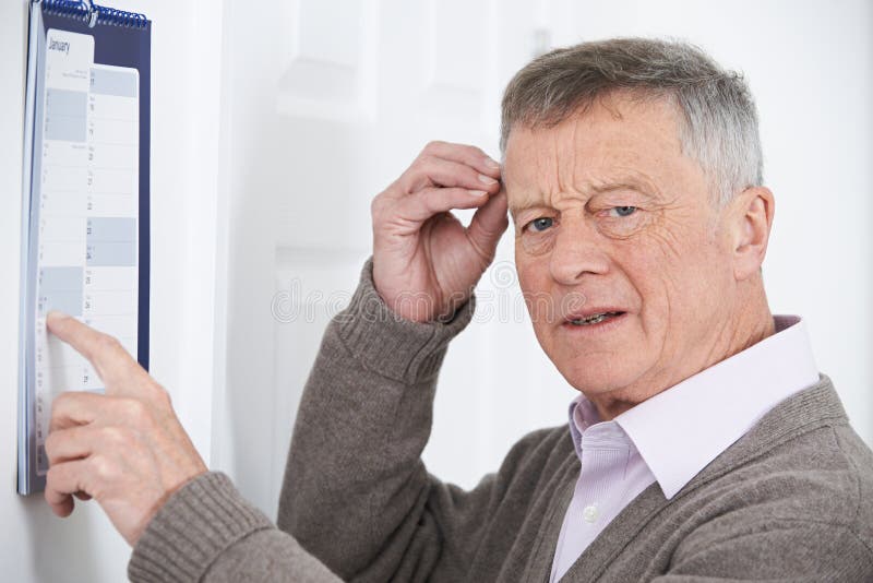 Confused Senior Man with Dementia Looking at Wall Calendar Stock Image ...