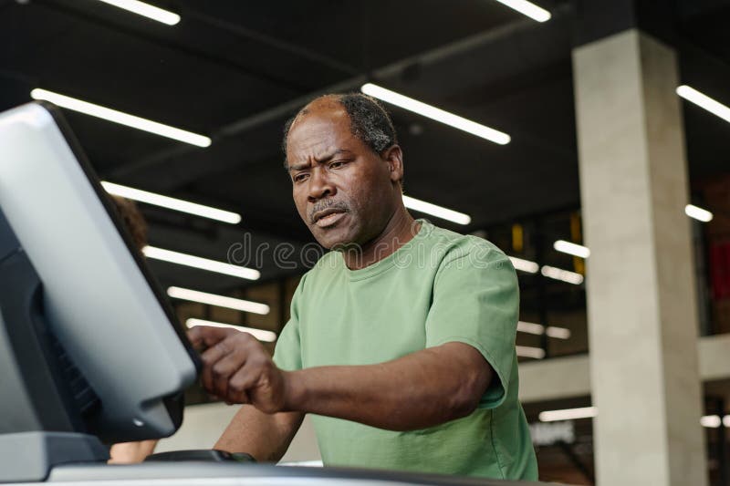 Confused Senior Man Looking at Treadmill Control Panel Stock Photo ...