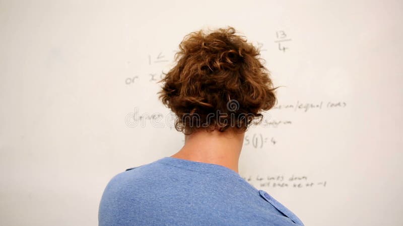 Confused Student Standing in Front of Whiteboard of Math Stock Video ...