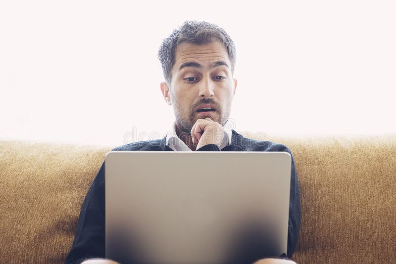 Confused Surprised Young Man Using a Pc Laptop Computer Stock Image ...