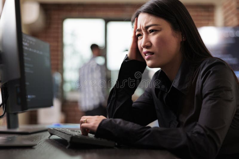 Confused Tech Engineer Sitting at Computer Trying To Solve Network Processing Errors. Stock ...