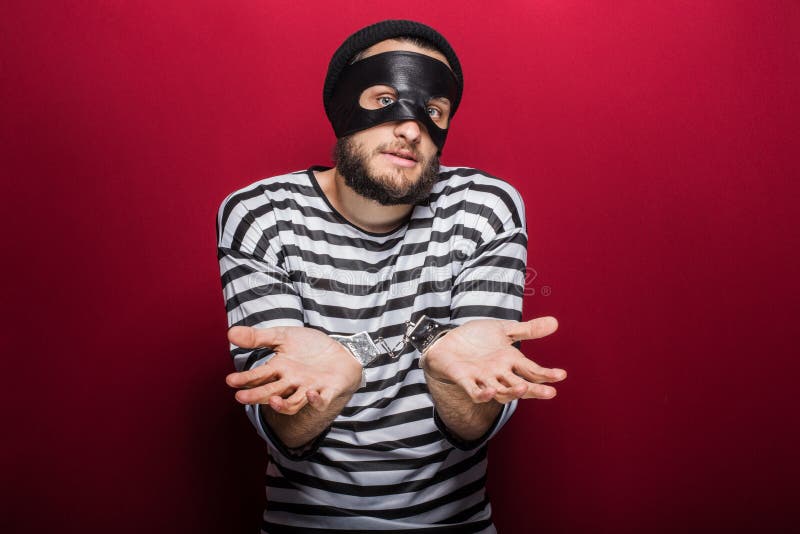 A Thief with Mask Quietly Slinking Stock Photo - Image of caucasian ...