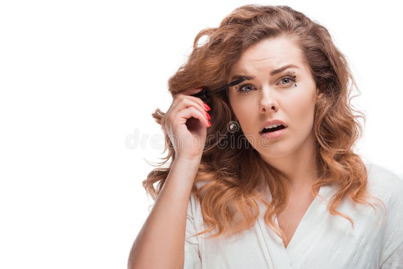 Confused Woman Looking at Camera while Applying Mascara Stock Image ...