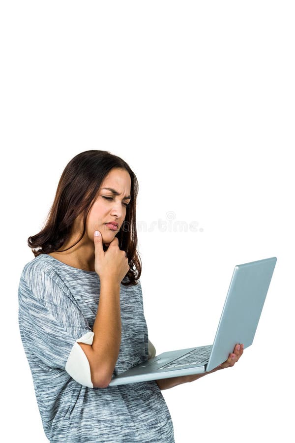 Confused Woman Using Laptop Stock Photo - Image of holding, notebook ...