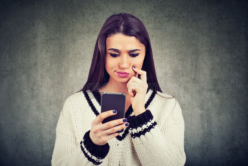 Confused Woman Using Mobile Phone Stock Photo - Image of fake, ethnic ...