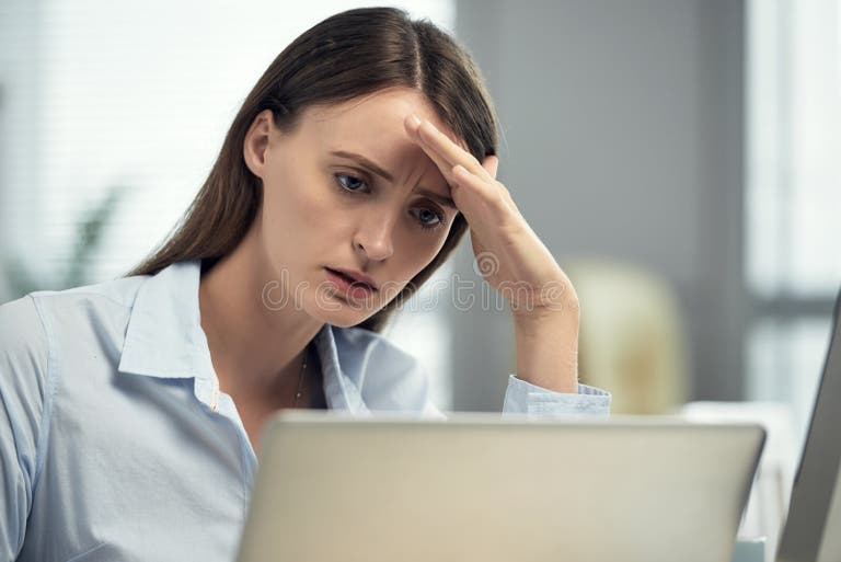 Confused Woman Watching Computer in Office Stock Photo - Image of ...
