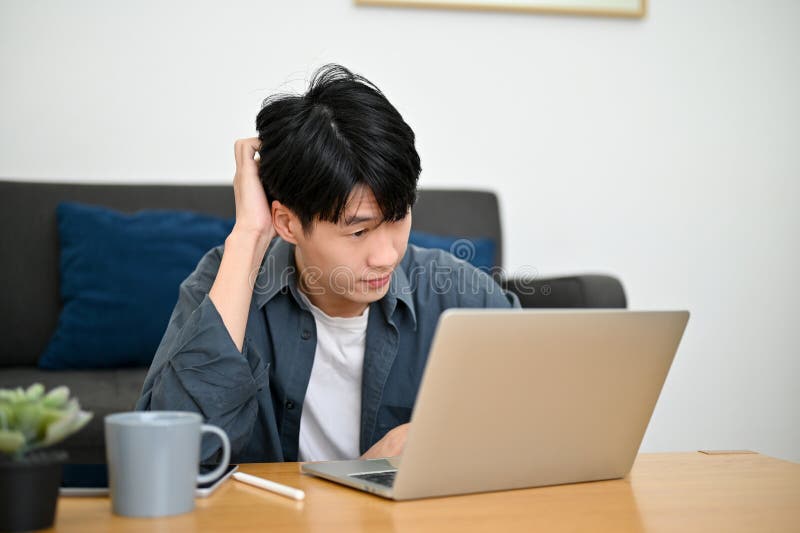Confused Young Asian Man Experiencing Internet Connection Issues at ...