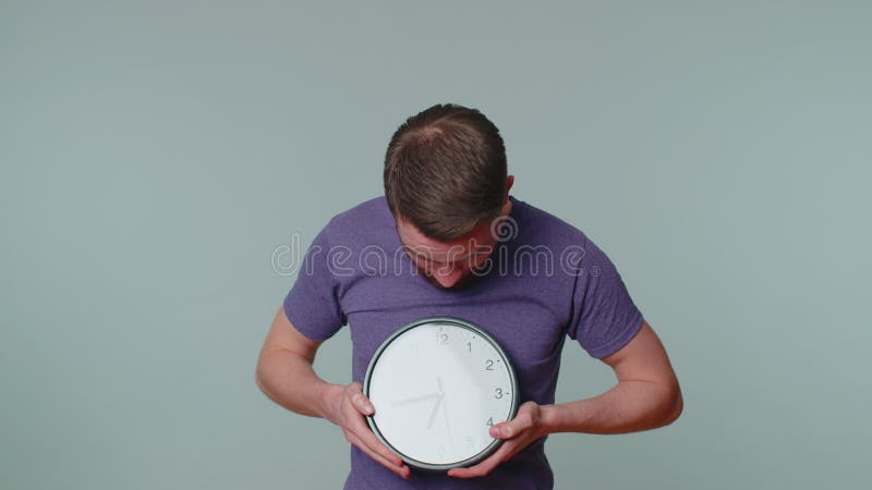 Confused Man with Anxiety Checking Time on Clock, Running Late To Work ...