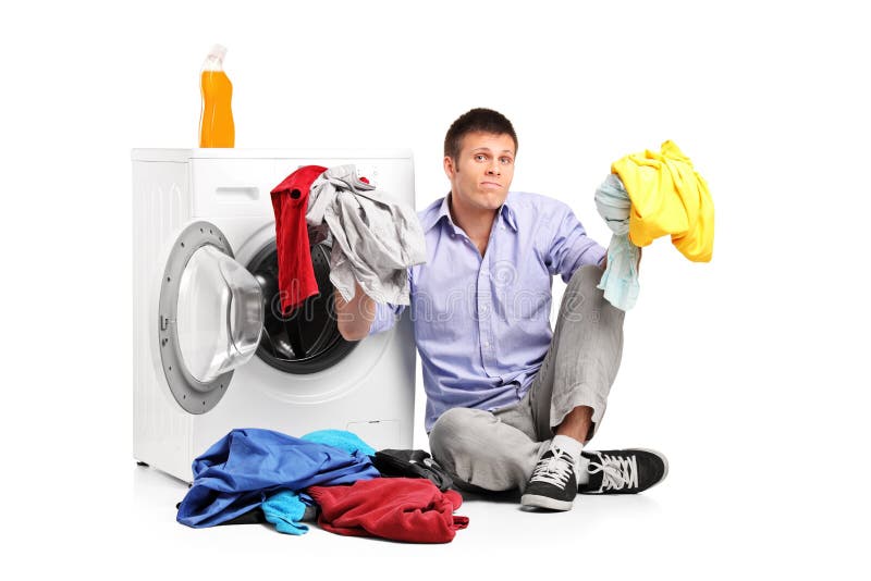 Confused Young Man Doing Laundry Stock Photo - Image: 41895277