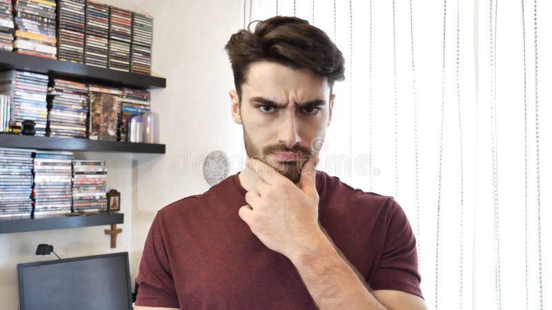 Confused or Doubtful Young Man Scratching His Chin Stock Photo - Image ...