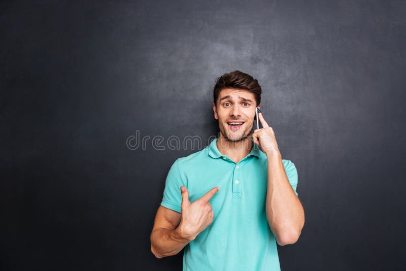 Confused Young Man Talking Cell Phone Over White Background Stock ...