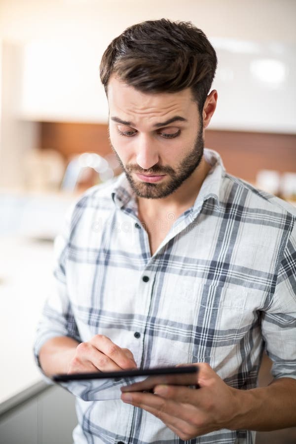 Confused Young Man Using Digital Tablet Kitchen Stock Photos - Free ...