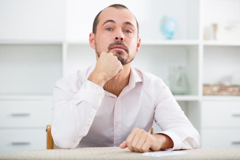 Confused Young Man at Workplace Stock Photo - Image of marketing ...