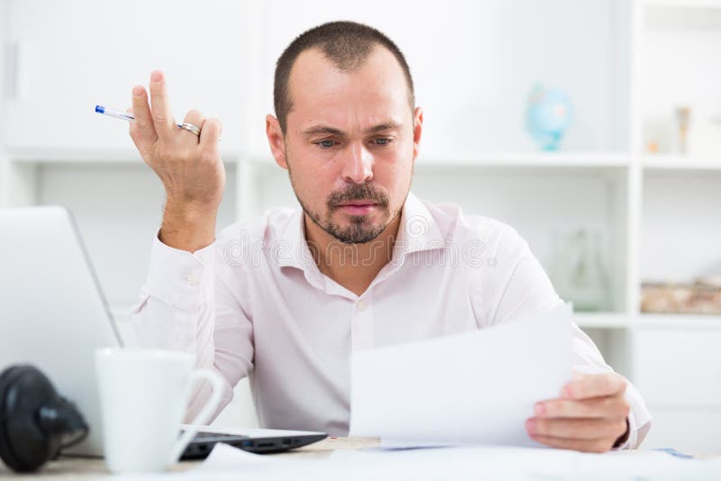 Confused Young Man at Workplace Stock Image - Image of occupation ...