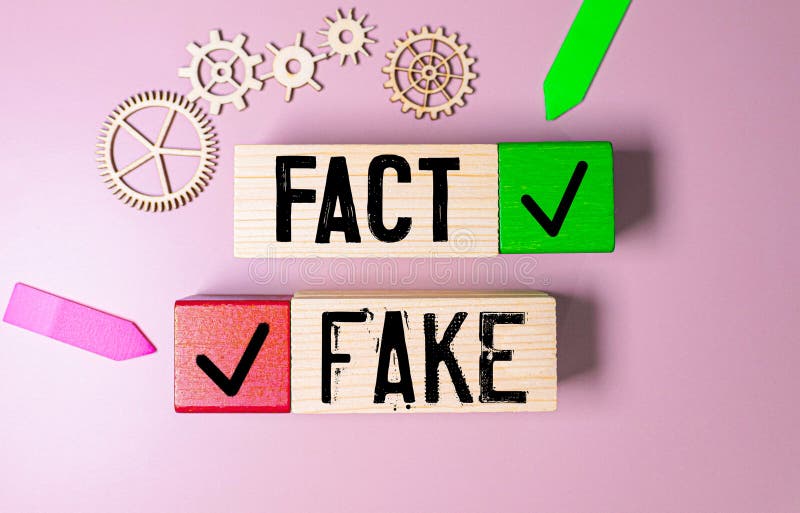Confusion between Fact and Fake News Using Wooden Cubes Stock Photo ...