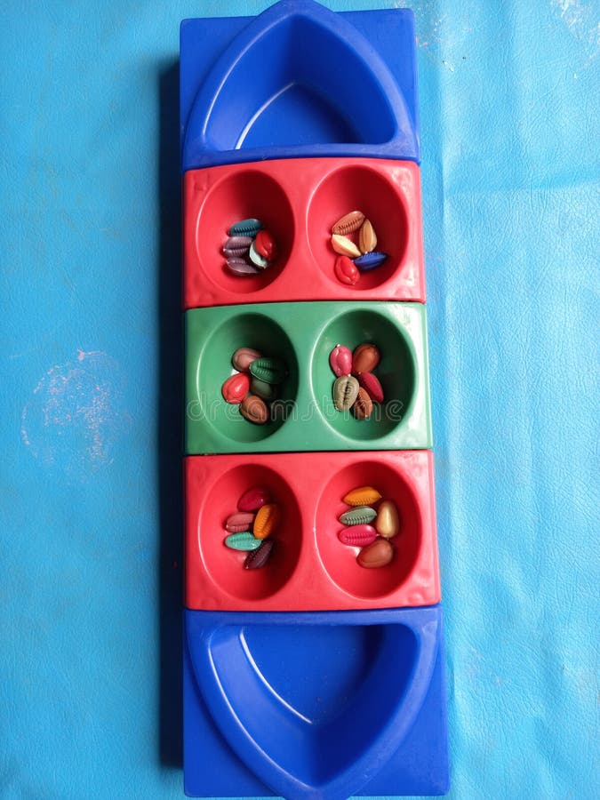 Congklak or Dakon stock image. Image of brand, purple - 266976643