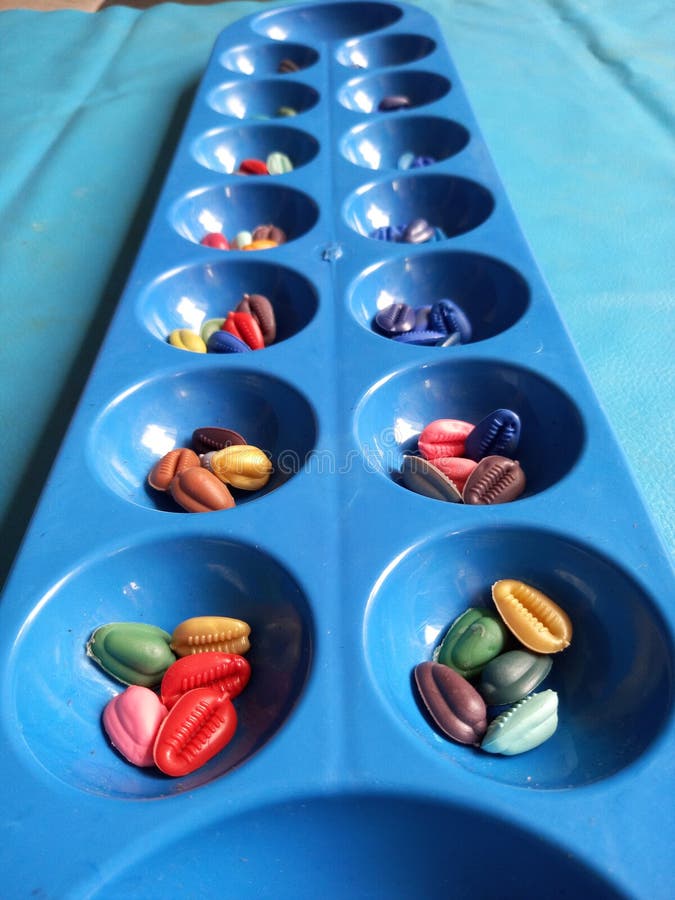 Congklak or Dakon stock photo. Image of blue, play, glass - 266976694